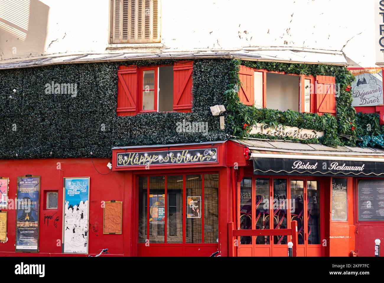 The view of Bistrot restaurant's red exterior in Paris, France Stock ...