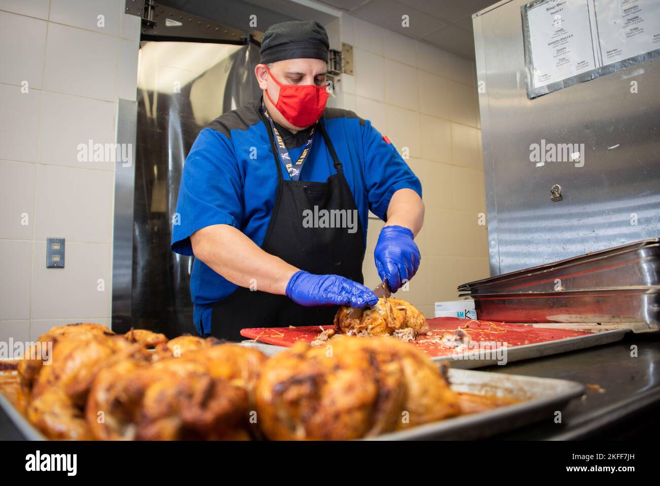 Russell Penberthy cuts rotisserie chicken at Brooke Army Medical Center ...