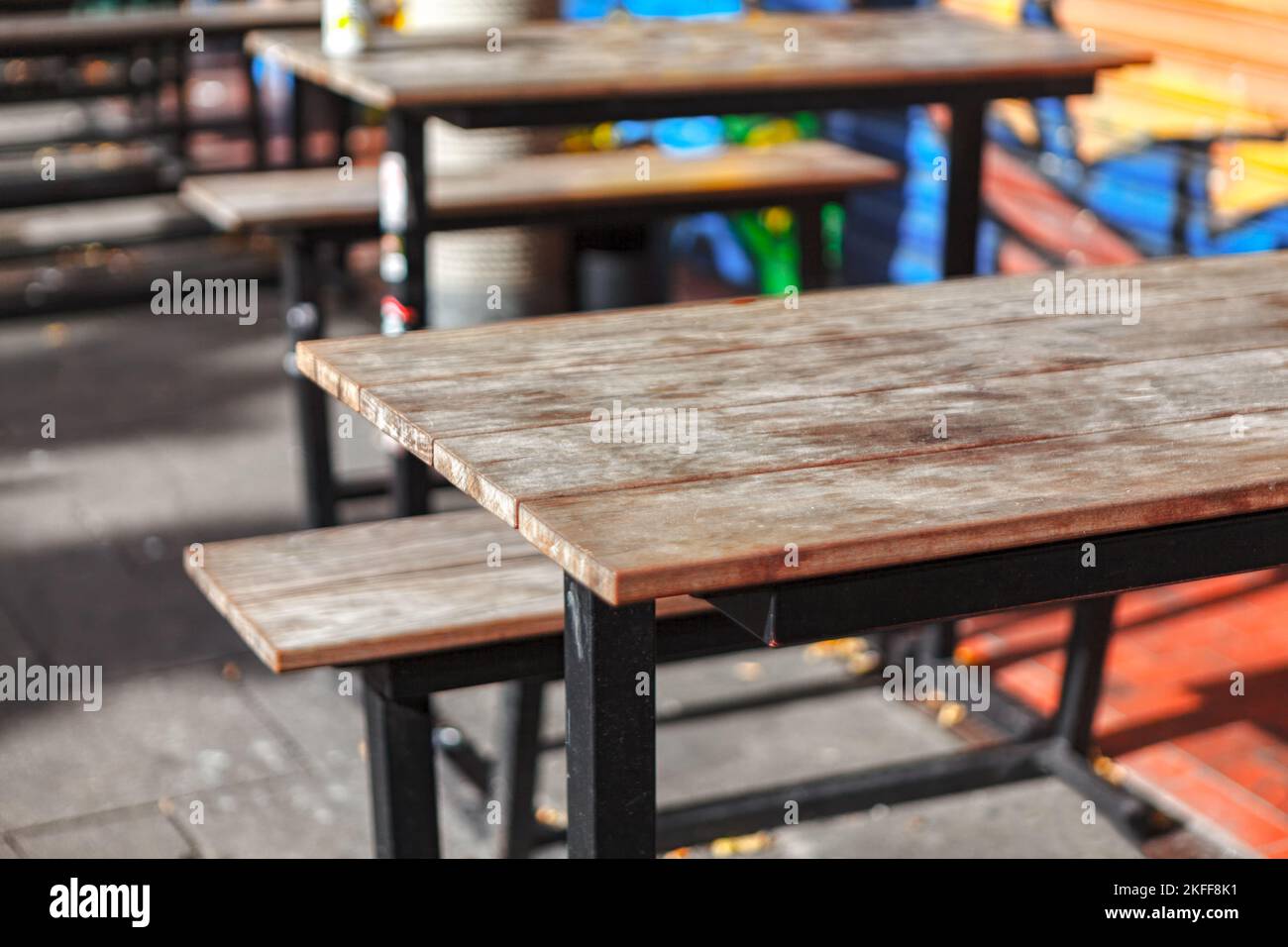 Wooden tables of street terrace . Empty tables of outdoor beer ...