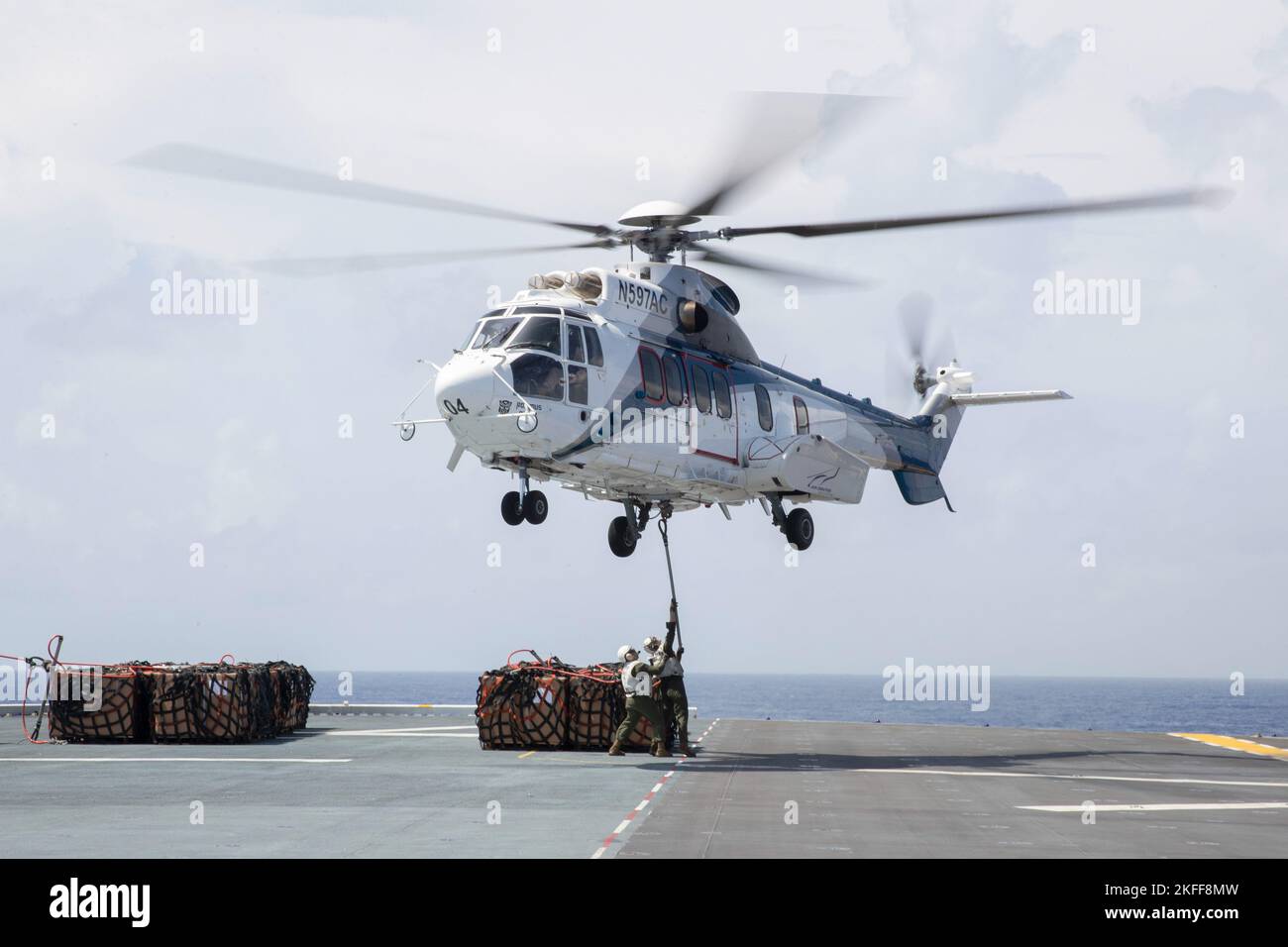 220915-N-XN177-2271 PHILIPPINE SEA (Sept. 15, 2022) – U.S. Marines attach a load of supplies to ...