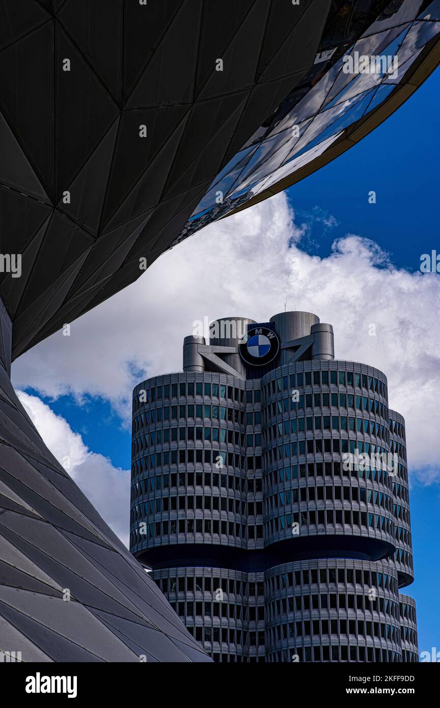 a vertical shot of BMW headquarters building in Munich, Germany with ...