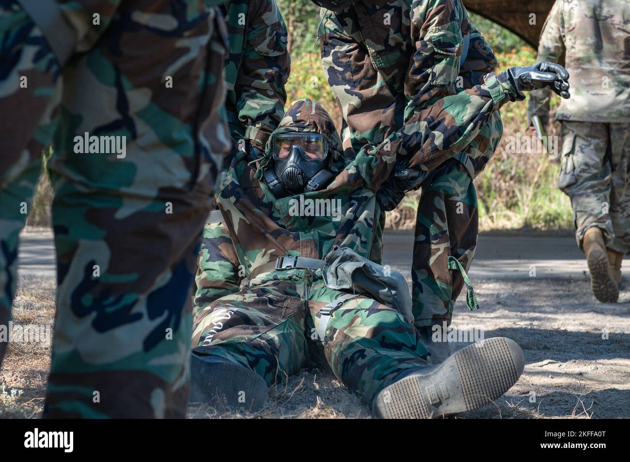 Airmen perform Self-Aid Buddy Care, during a chemical, biological ...