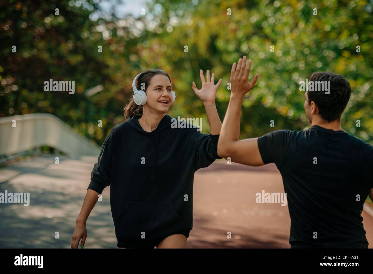 Beautiful sporty couple high five hi-res stock photography and images ...