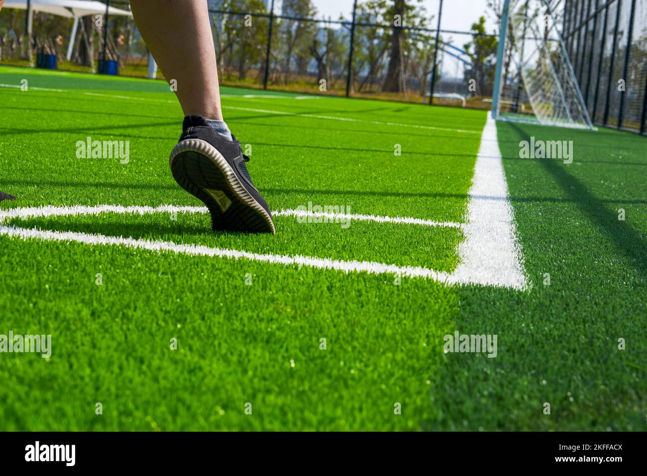A player takes a corner kick on a brand new soccer field Stock Photo ...