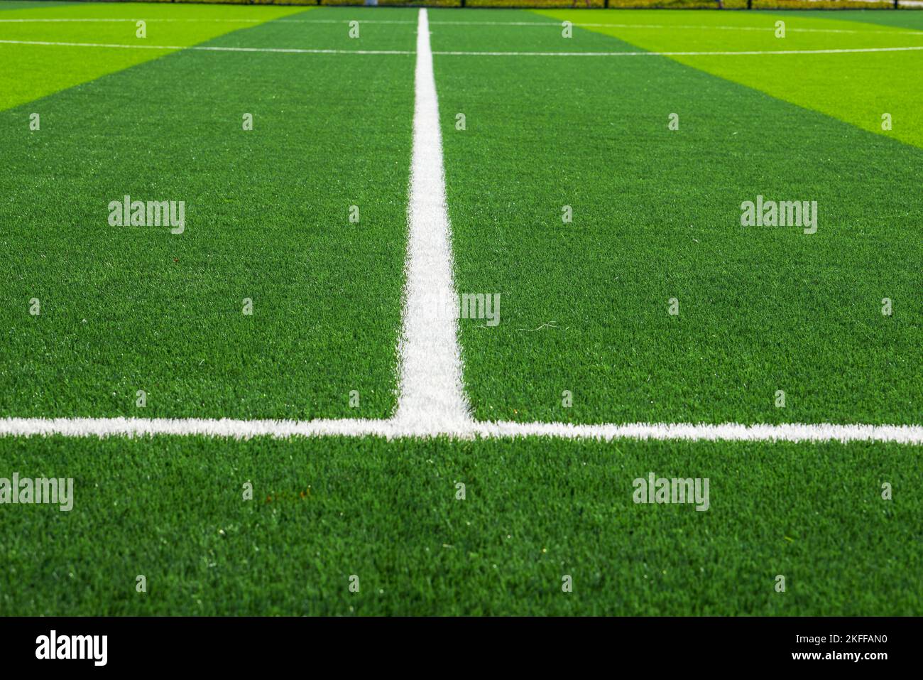 Close-up of the goal and touchline of a brand new football stadium ...