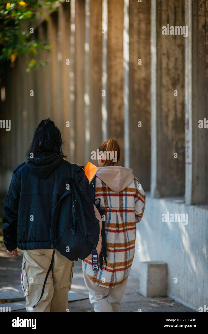 High school friends talking while walking to the school Stock Photo - Alamy