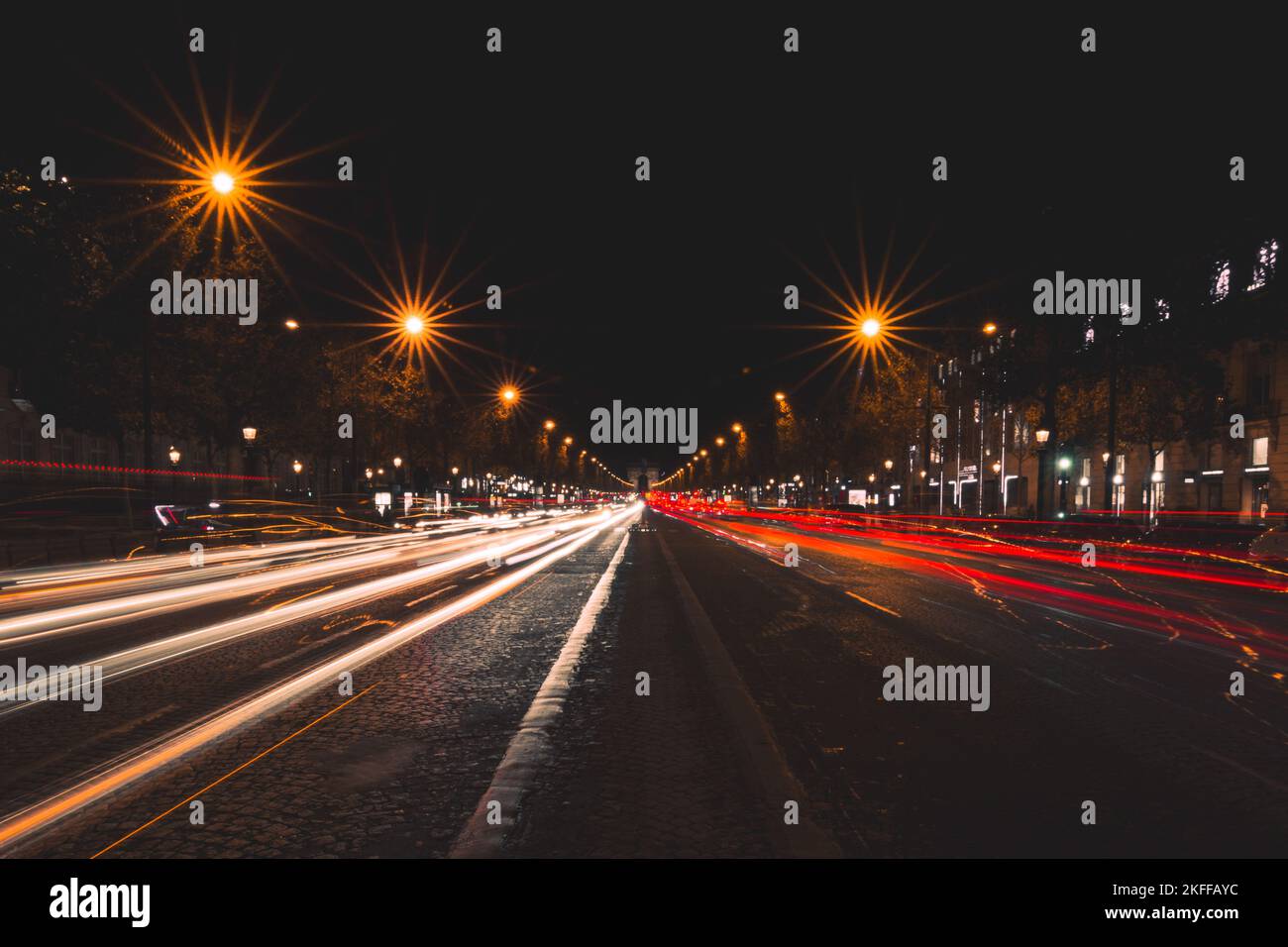 Scenic view of traffic light trails on Champs Elysee in Paris at night ...