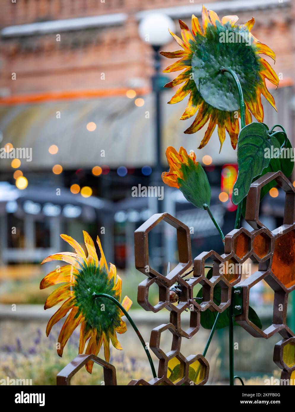 A vertical shot of metal sunflowers in a park in Nelson, Canada Stock ...