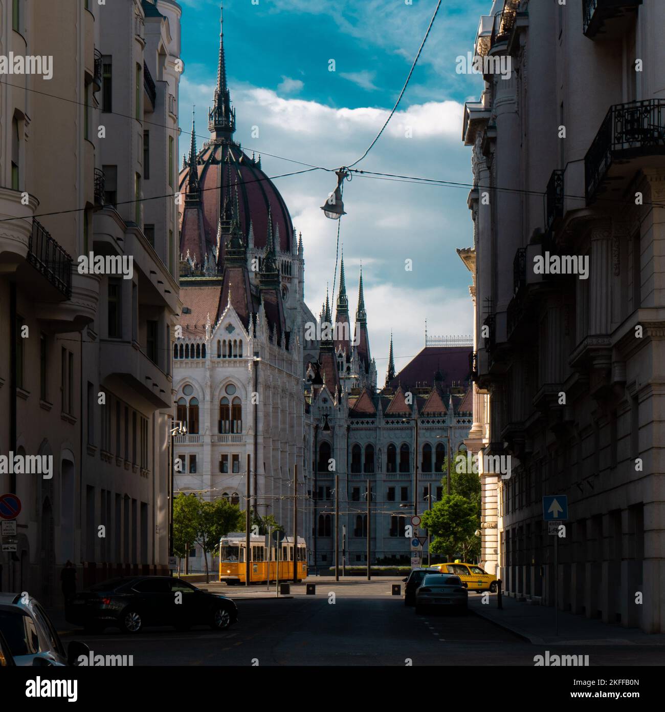 The Hungarian parliament building and traditional yellow tram seen from ...