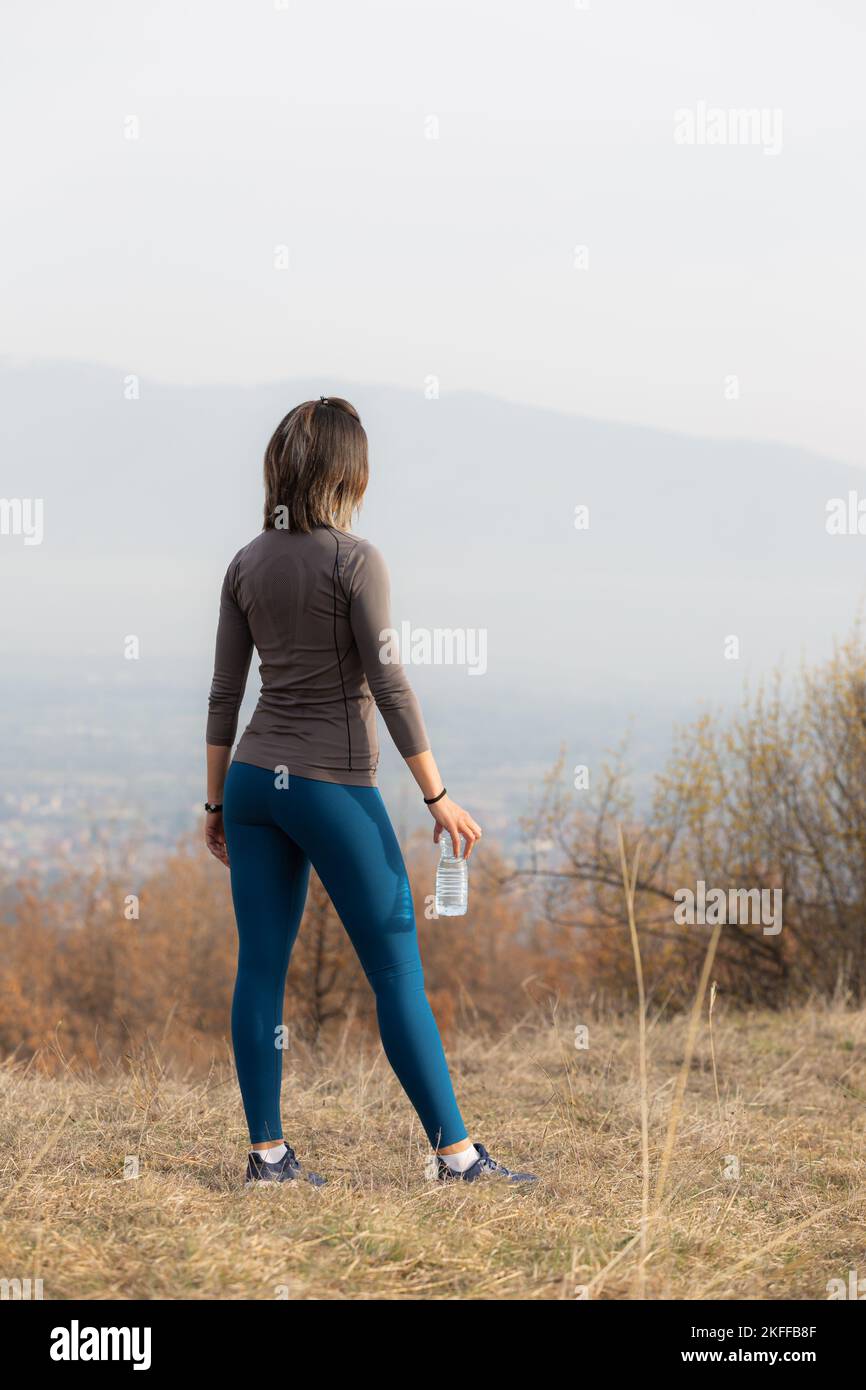 Amazing and active woman is thinking about her training Stock Photo - Alamy