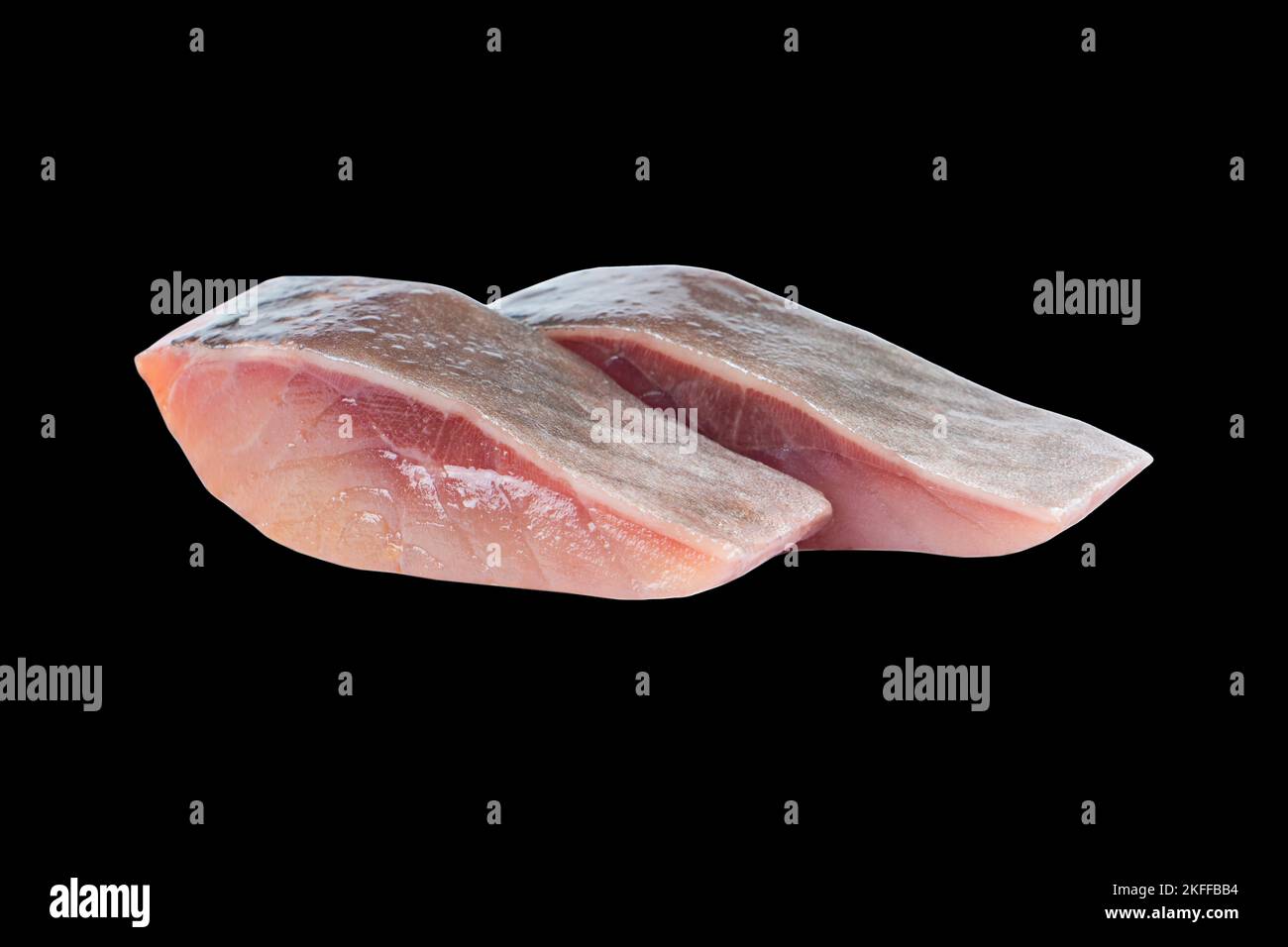 Macro shot herring fillet slices isolated on black background. Matie ...