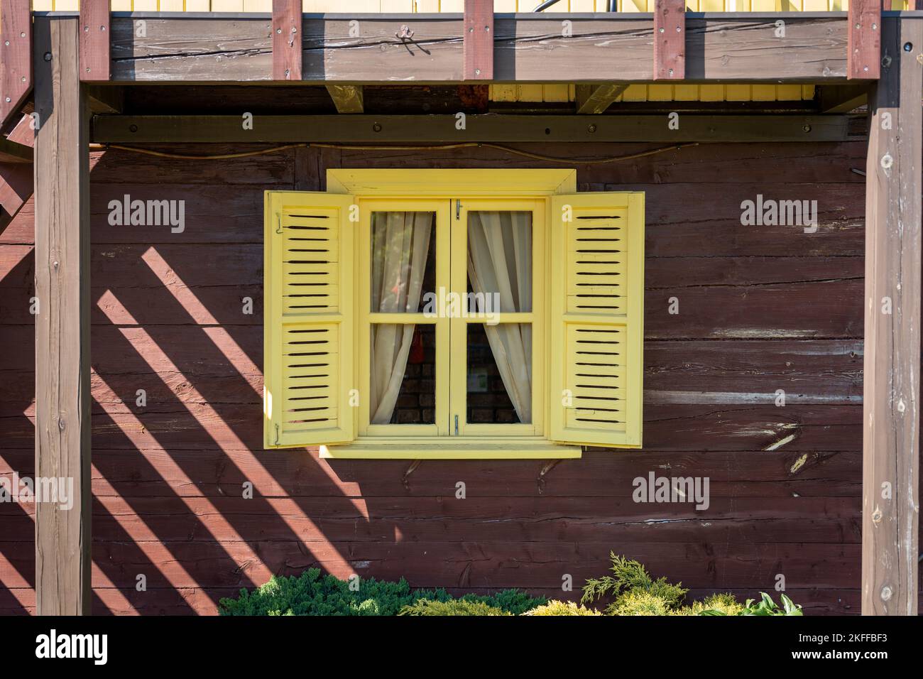 An old fashioned yellow window frame Stock Photo - Alamy