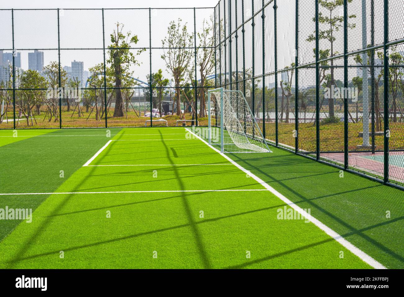 Close-up of the goal and touchline of a brand new football stadium ...