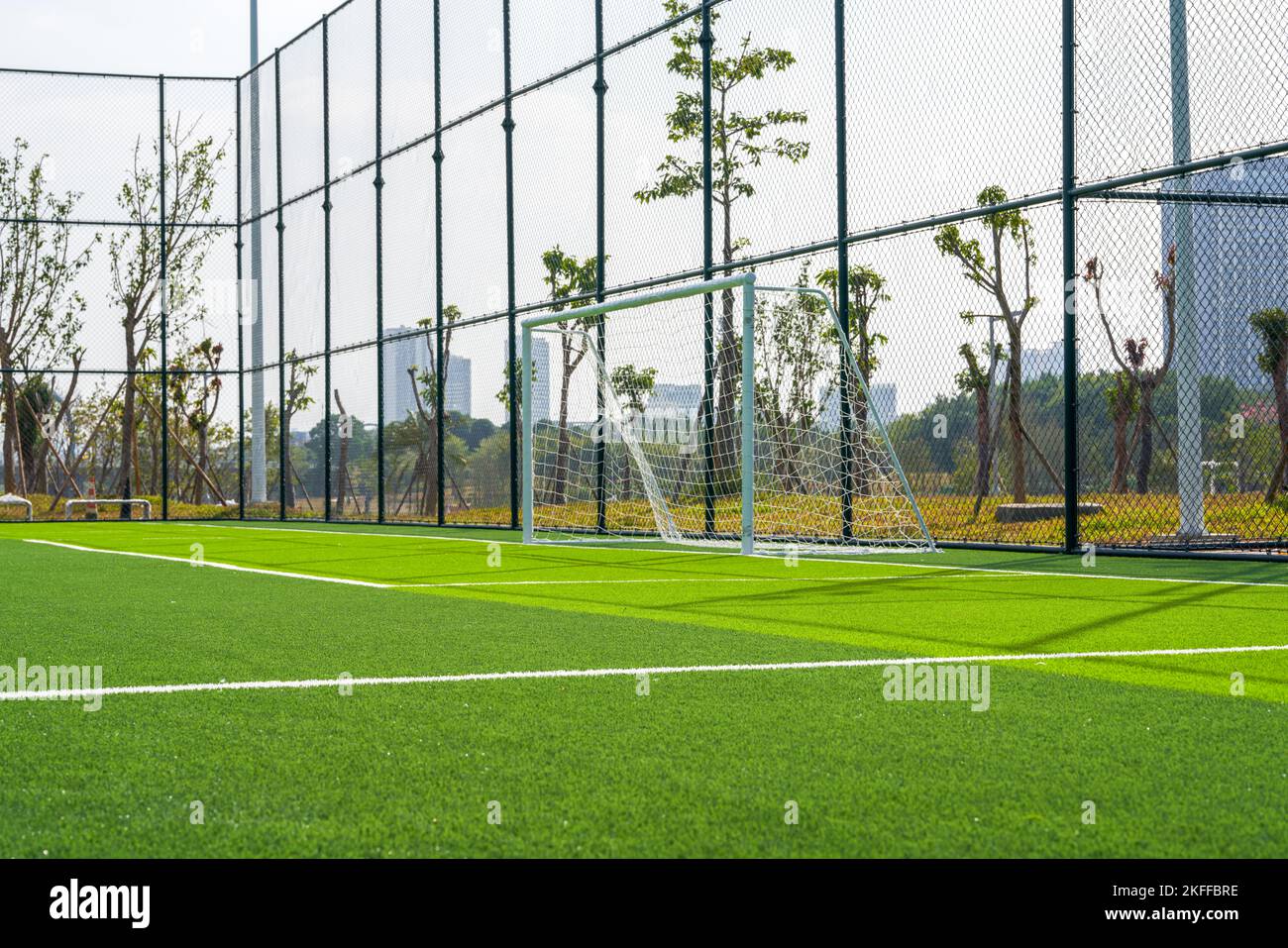 Close-up of the goal and touchline of a brand new football stadium ...