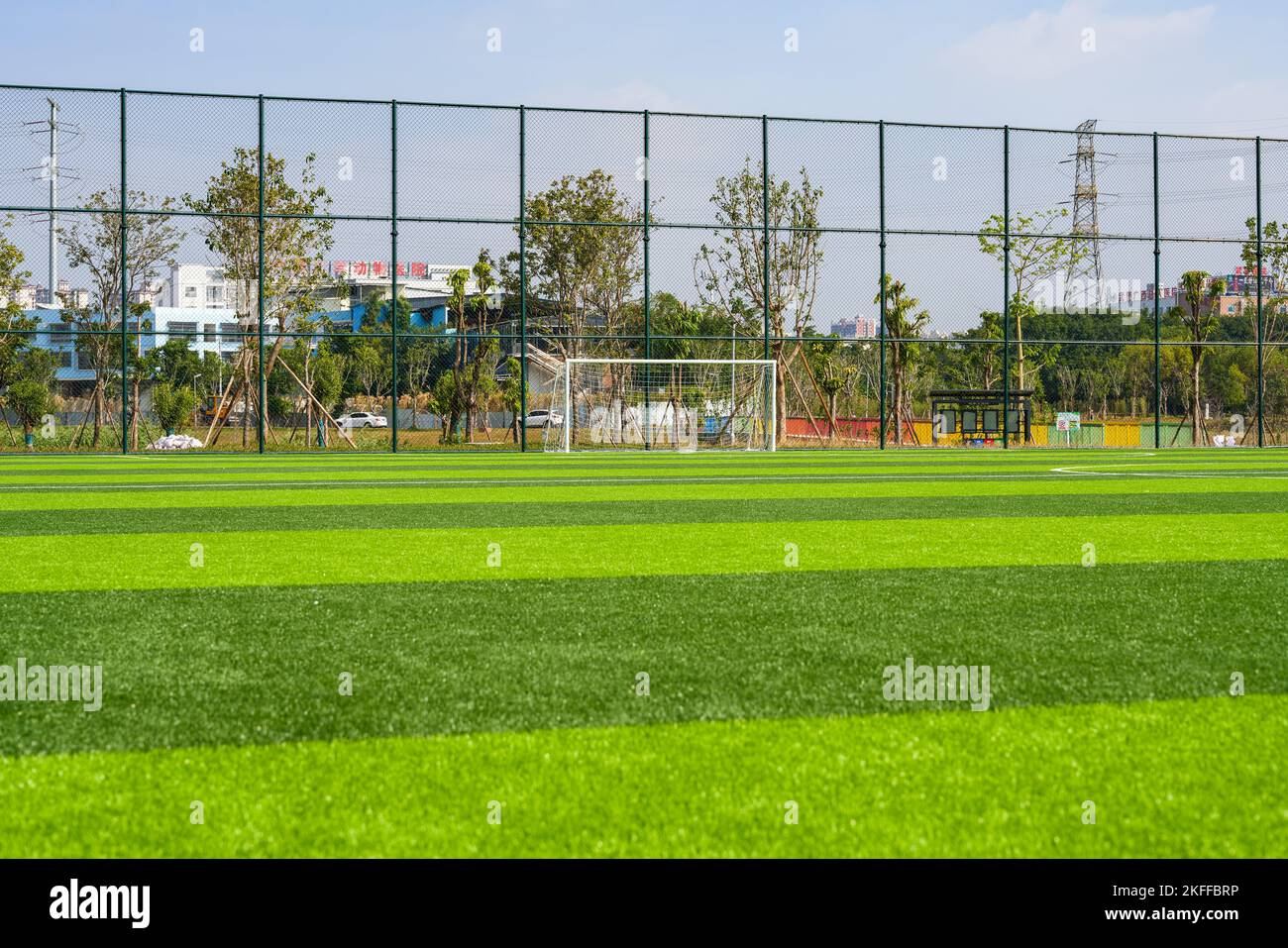 Close-up of the goal and touchline of a brand new football stadium ...