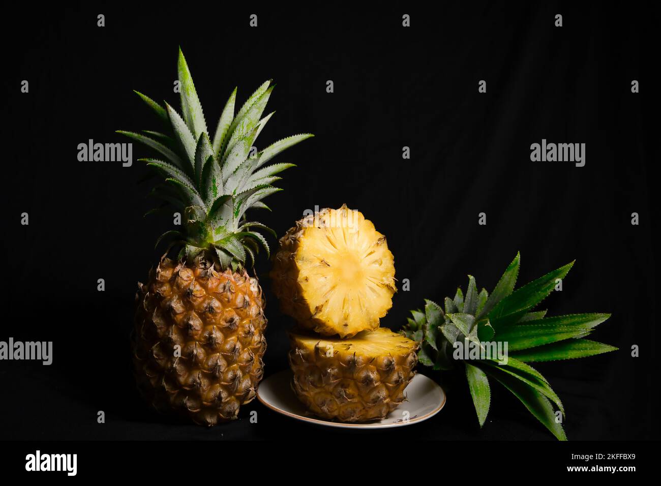 Pineapple on Black background Stock Photo - Alamy