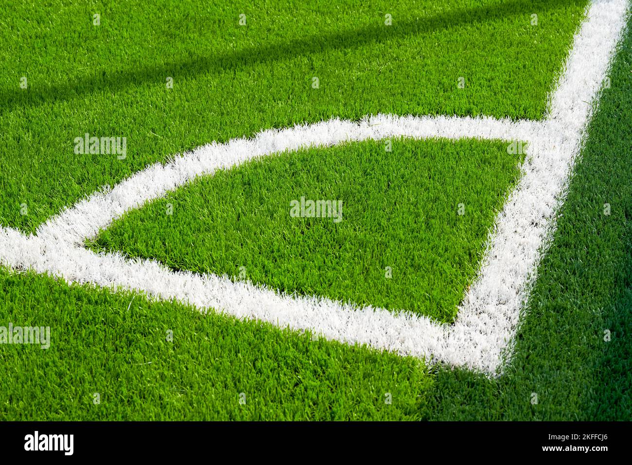 Close-up of the goal and touchline of a brand new football stadium ...