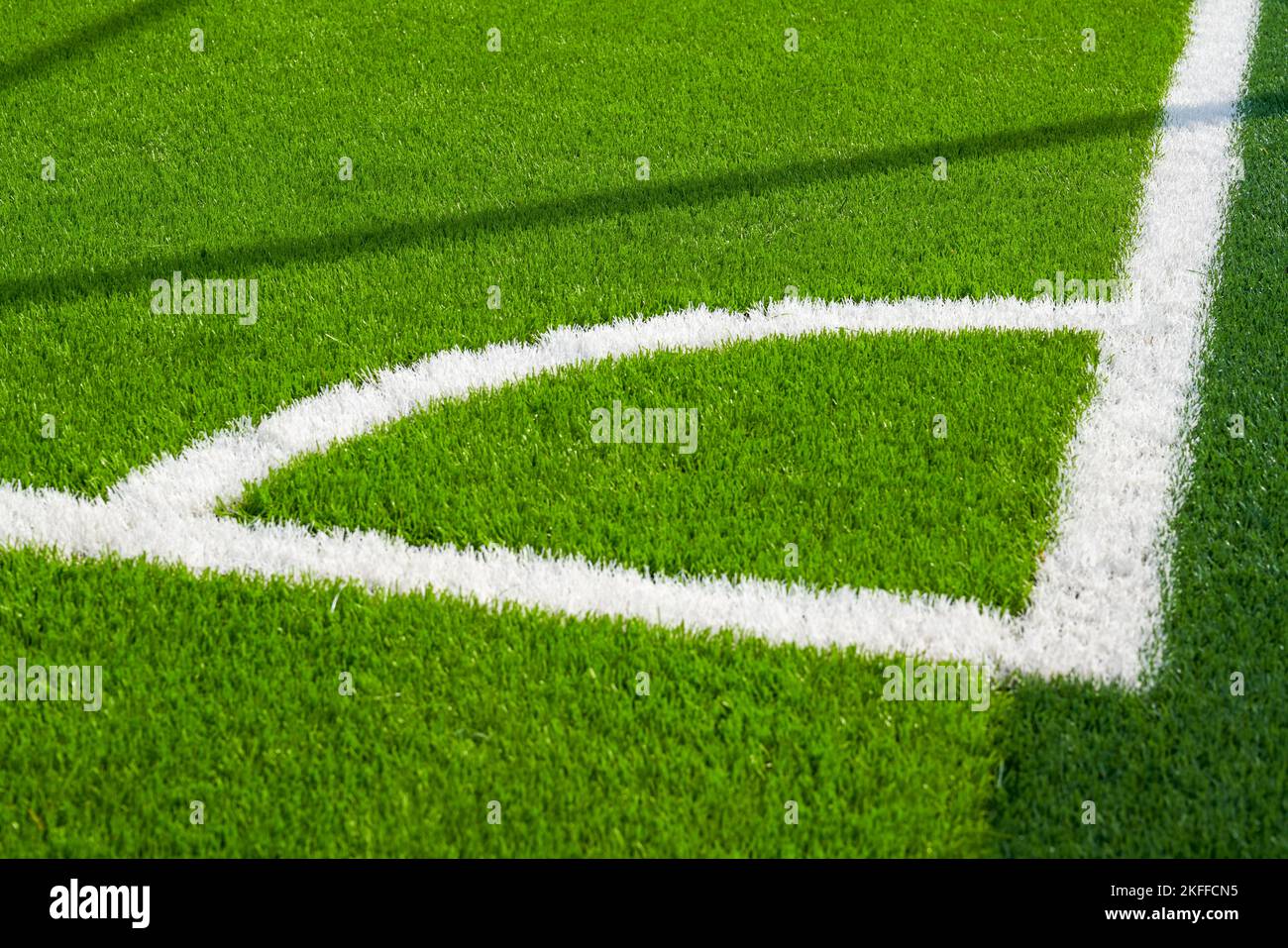 Close-up of the goal and touchline of a brand new football stadium ...