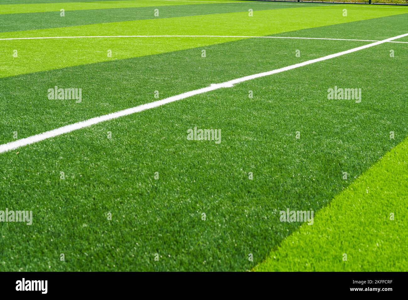 Close-up of the goal and touchline of a brand new football stadium ...