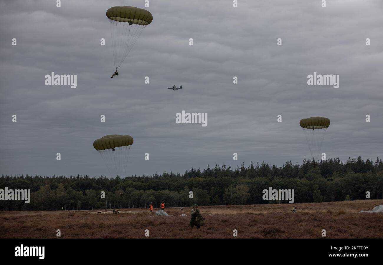 A group of U.S. Army and European Paratroopers decends to the Drop Zone ...