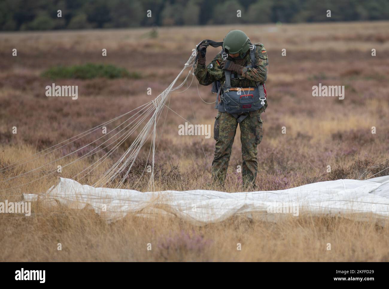 A German Paratrooper derigs his Polish parachute after landing on the ...