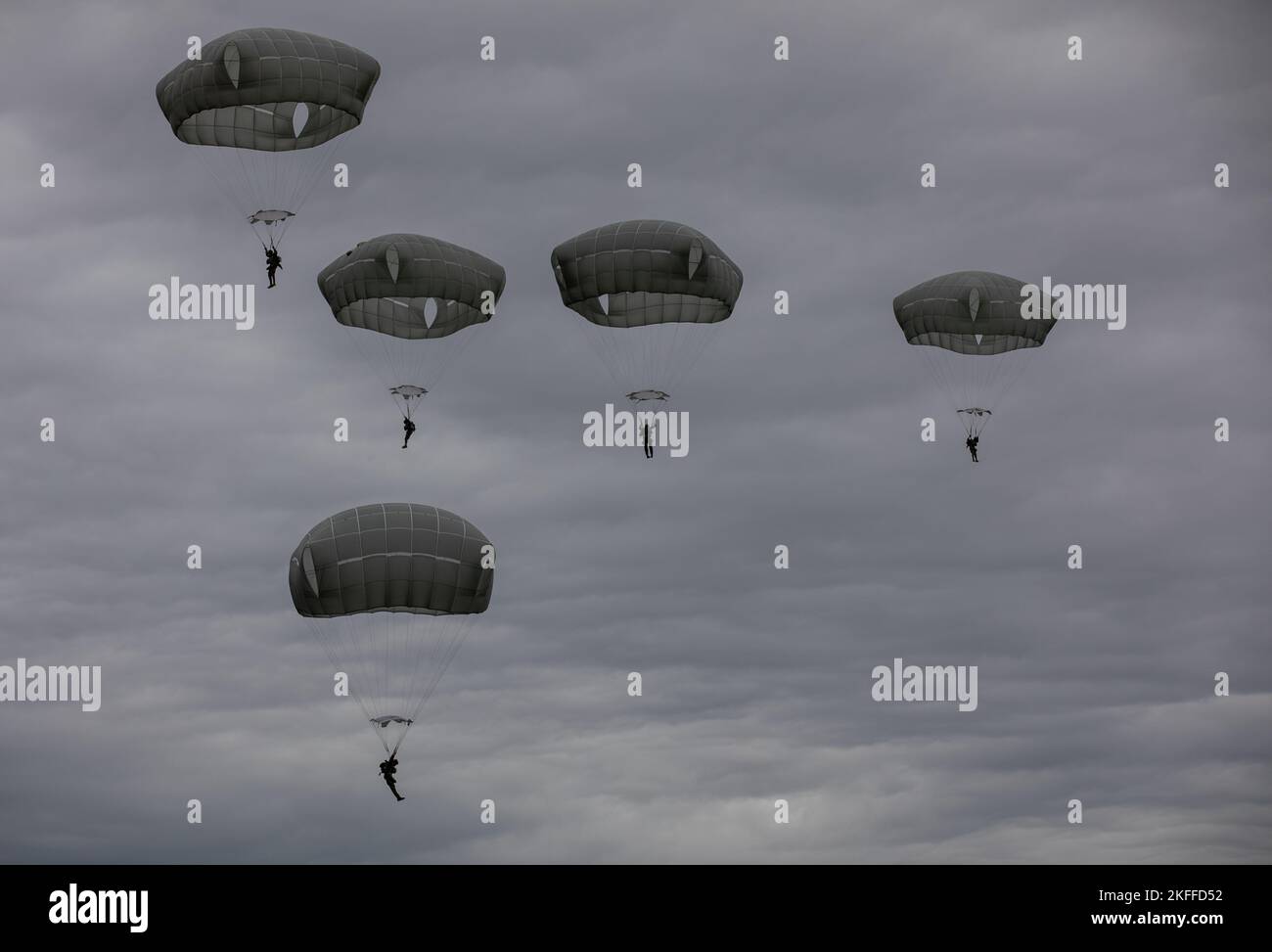 A group of U.S. Army and European Paratroopers decends to the Drop Zone ...