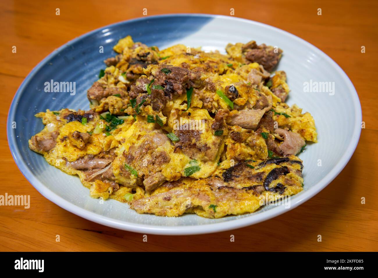 A delicious Chinese dish, scrambled eggs with fish offal Stock Photo ...