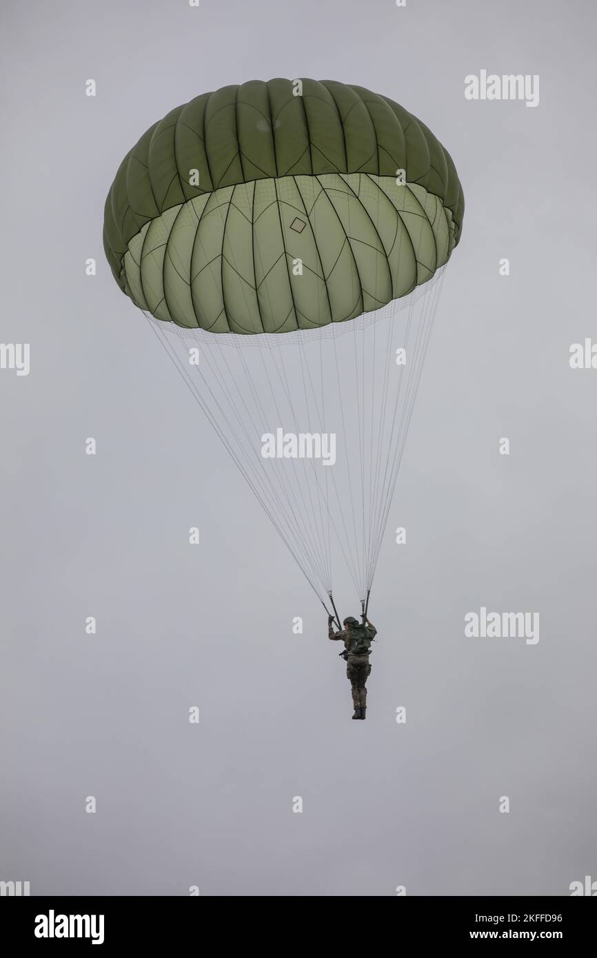 A Dutch Paratrooper decends to the Drop Zone using his German T-10 ...