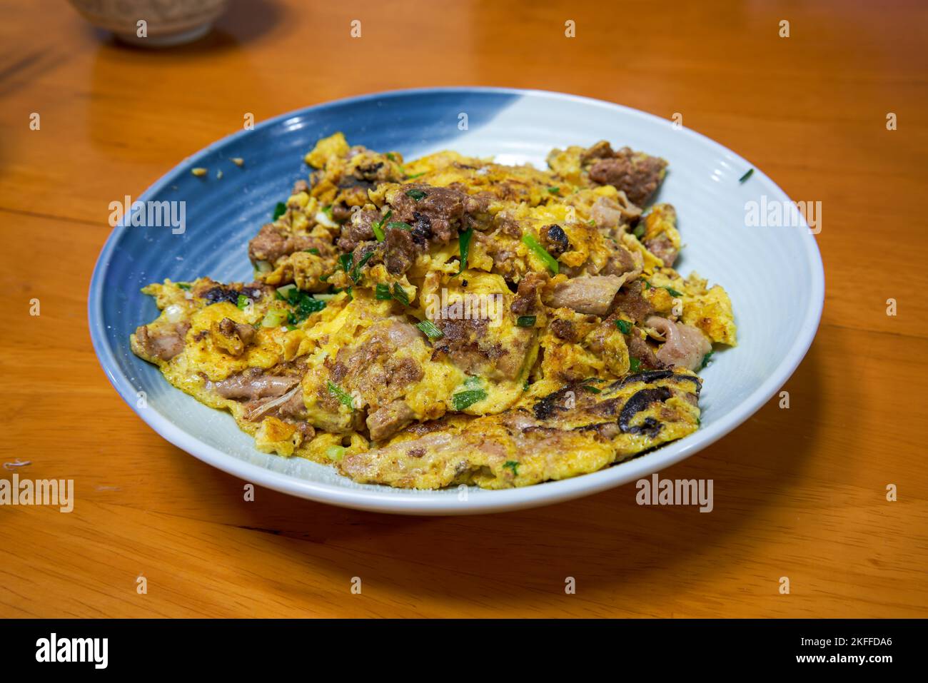A delicious Chinese dish, scrambled eggs with fish offal Stock Photo ...