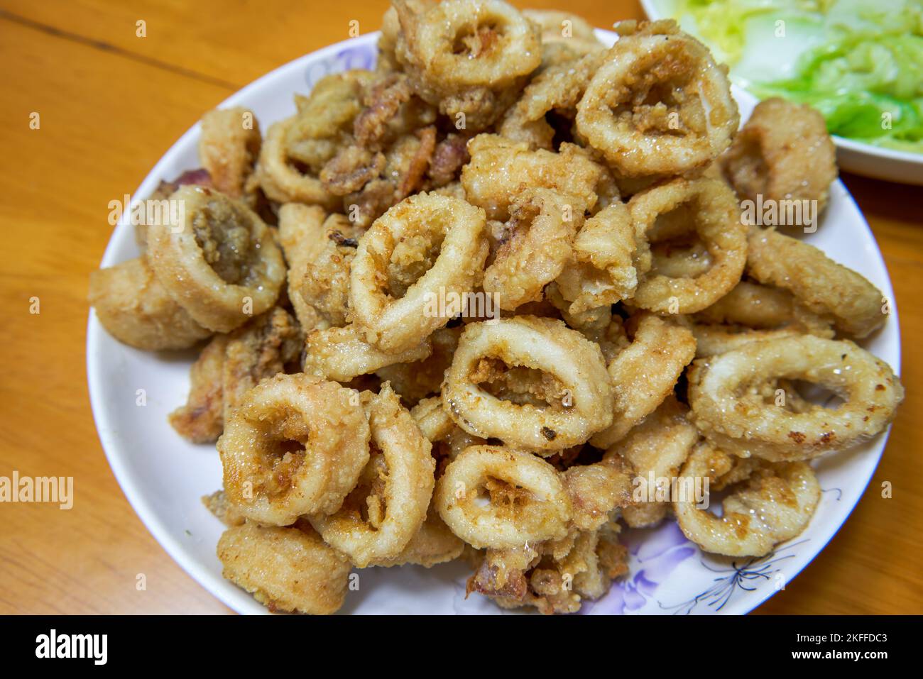 A golden and tempting deep-fried crispy squid ring Stock Photo - Alamy