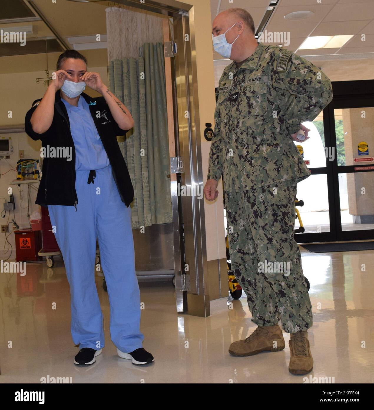 A tearful surprise of joy...Hospital Corpsman 2nd Class Monica Yineman ...