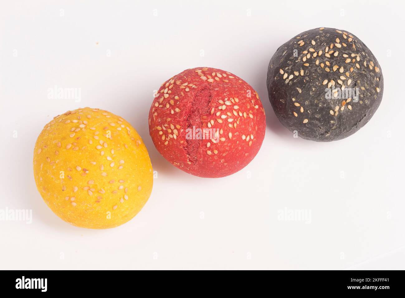 Colorful seasoned bread resting on a white background Stock Photo - Alamy