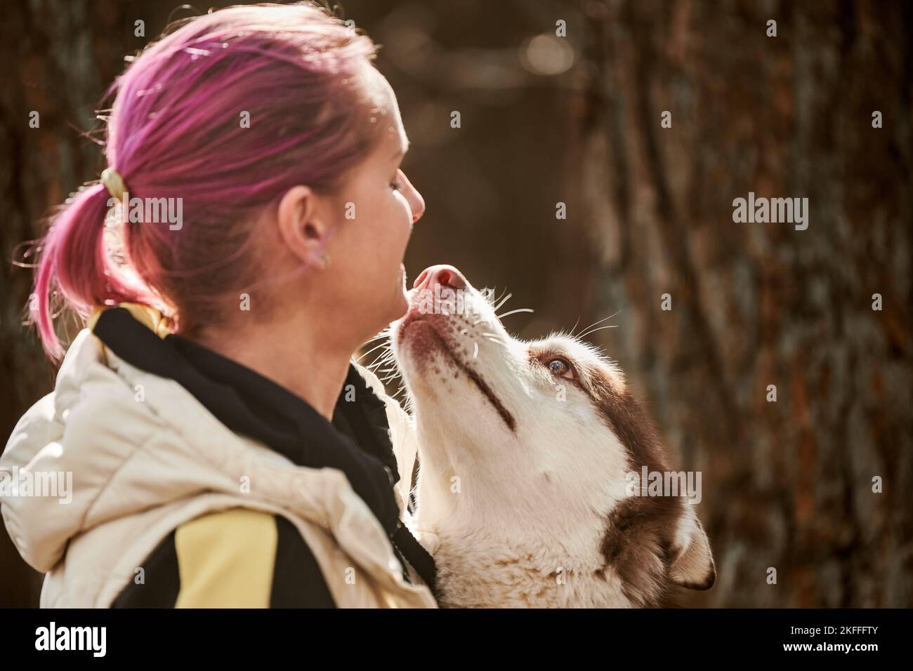 Siberian Husky dog kissing woman with pink hair, true love of human and ...