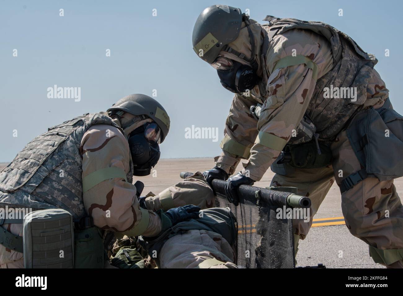 U.S. Air Force Airmen secure a simulated casualty on a litter during a ...