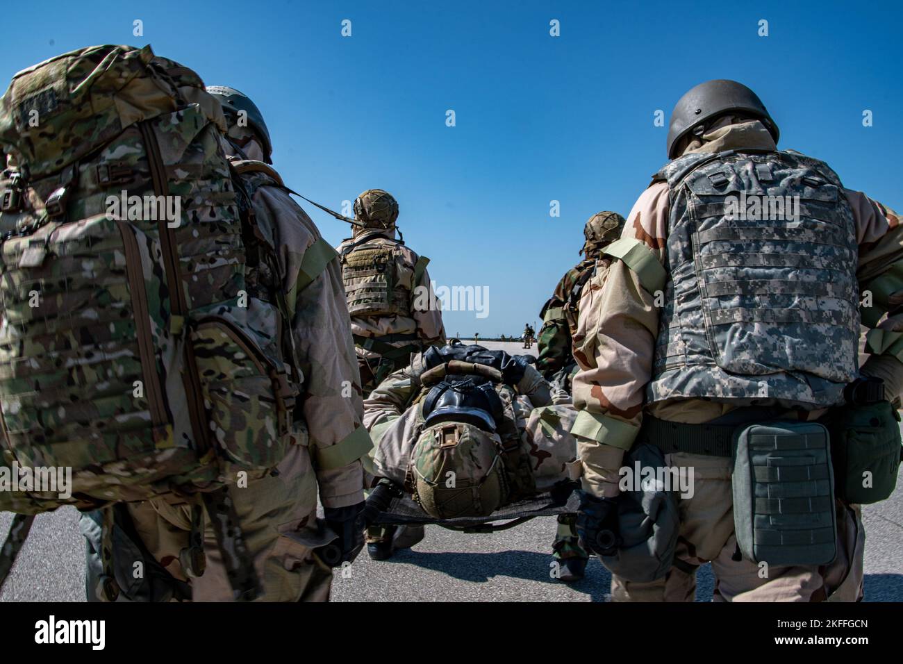 U.S. Air Force Airmen carry a simulated casualty on a litter during a ...