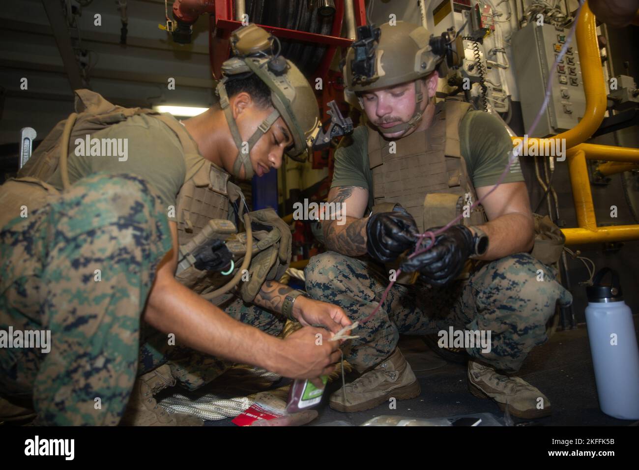 U.S. Navy hospital corpsman 3rd class Gavin Knowles, right, and ...