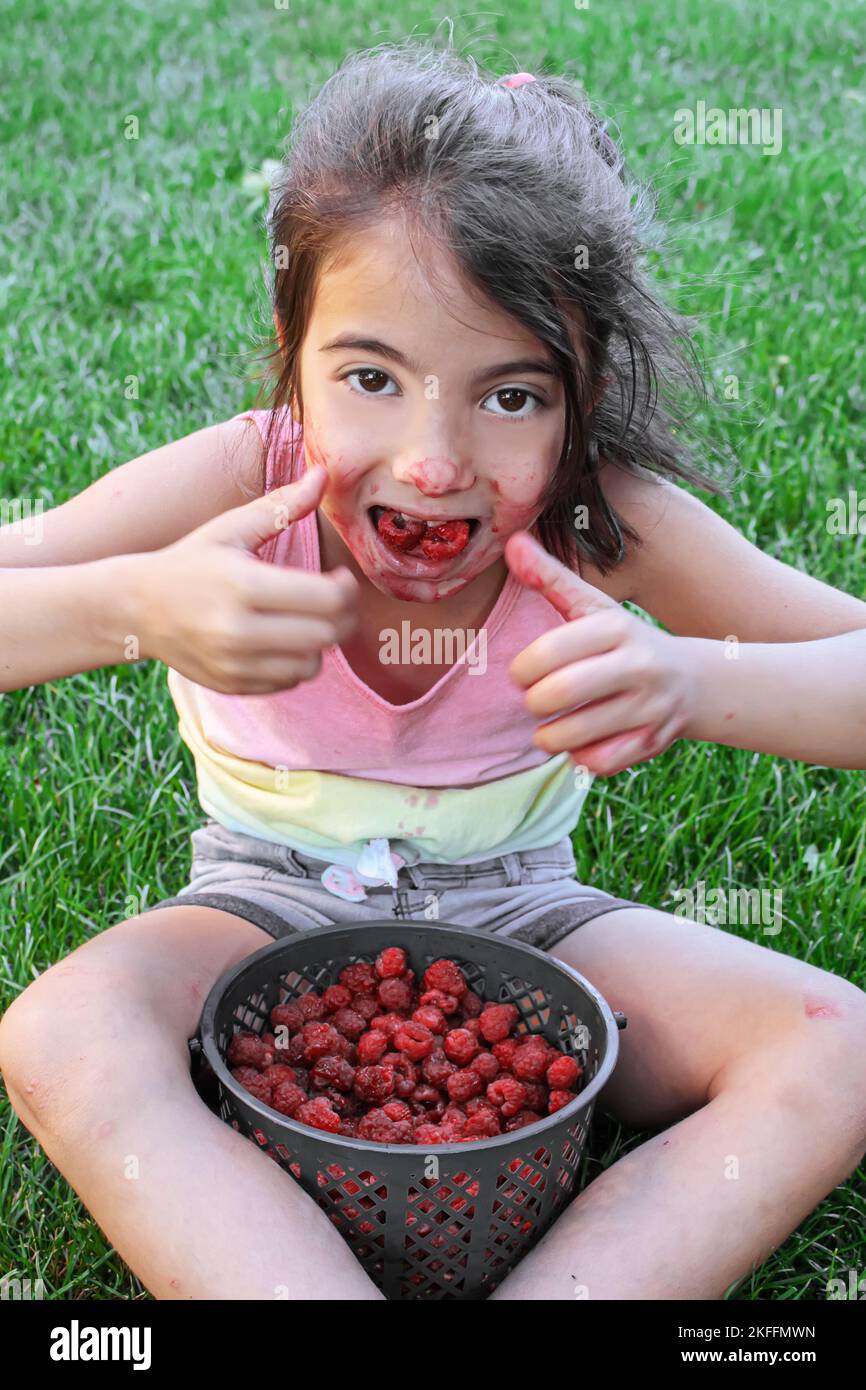 child holding raspberries in his hands.selective focus.food Stock Photo ...