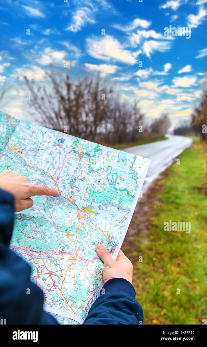 Young traveler on road trip reading map hi-res stock photography and ...