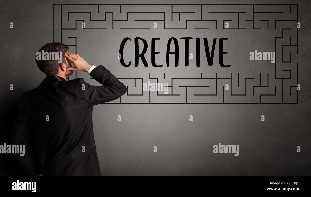 businessman drawing maze concept Stock Photo - Alamy
