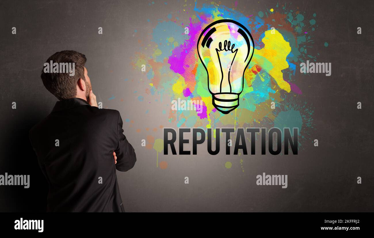 businessman drawing colorful light bulb Stock Photo - Alamy