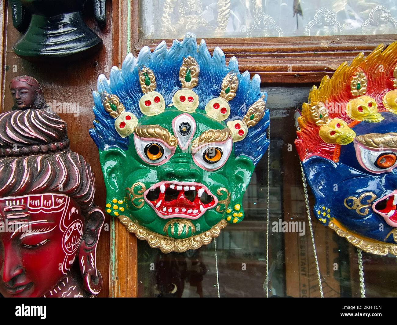Colorful wooden masks and handicrafts on sale at shop in the Sikkim ...