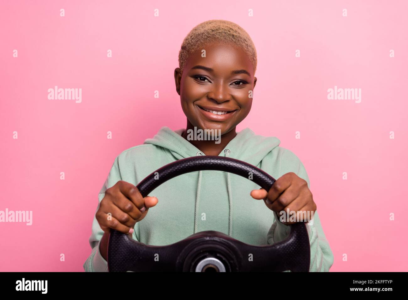 Photo of young pretty taxi driver female with short fair haircut ...