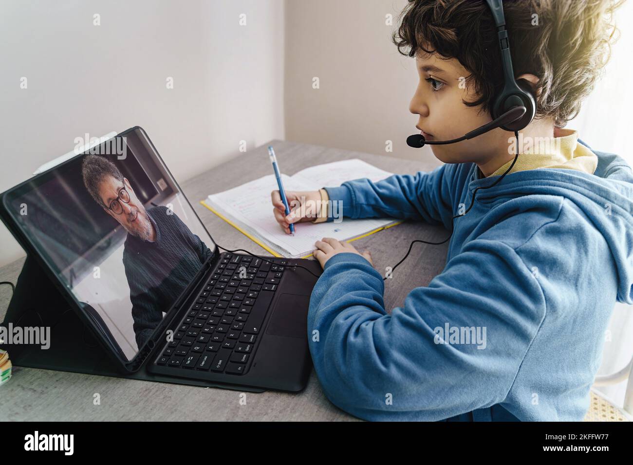 Ten year old schoolboy follows school lessons online - little man ...