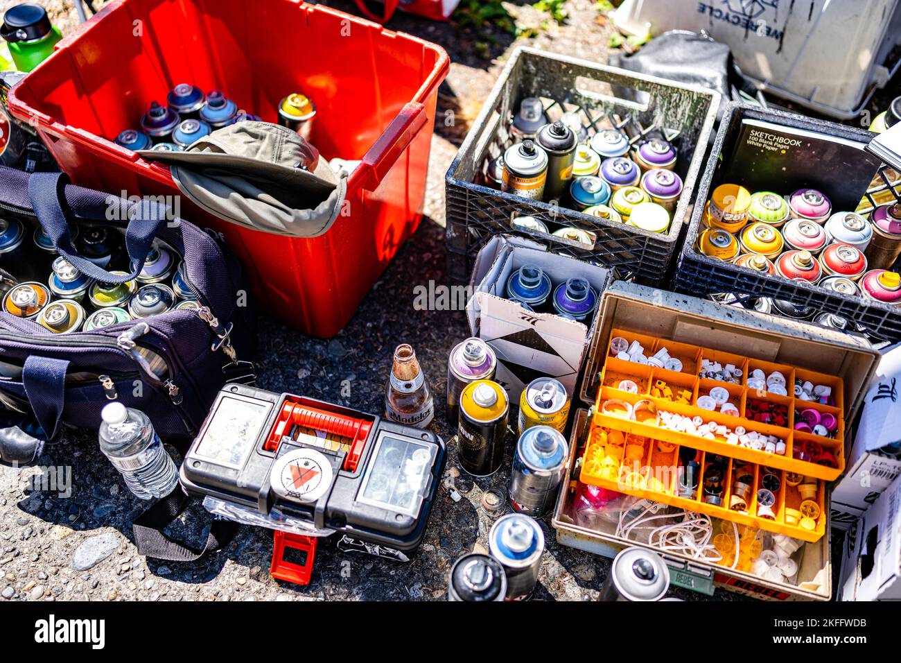 The view of spray paints and other tools for graffiti art on the street ...