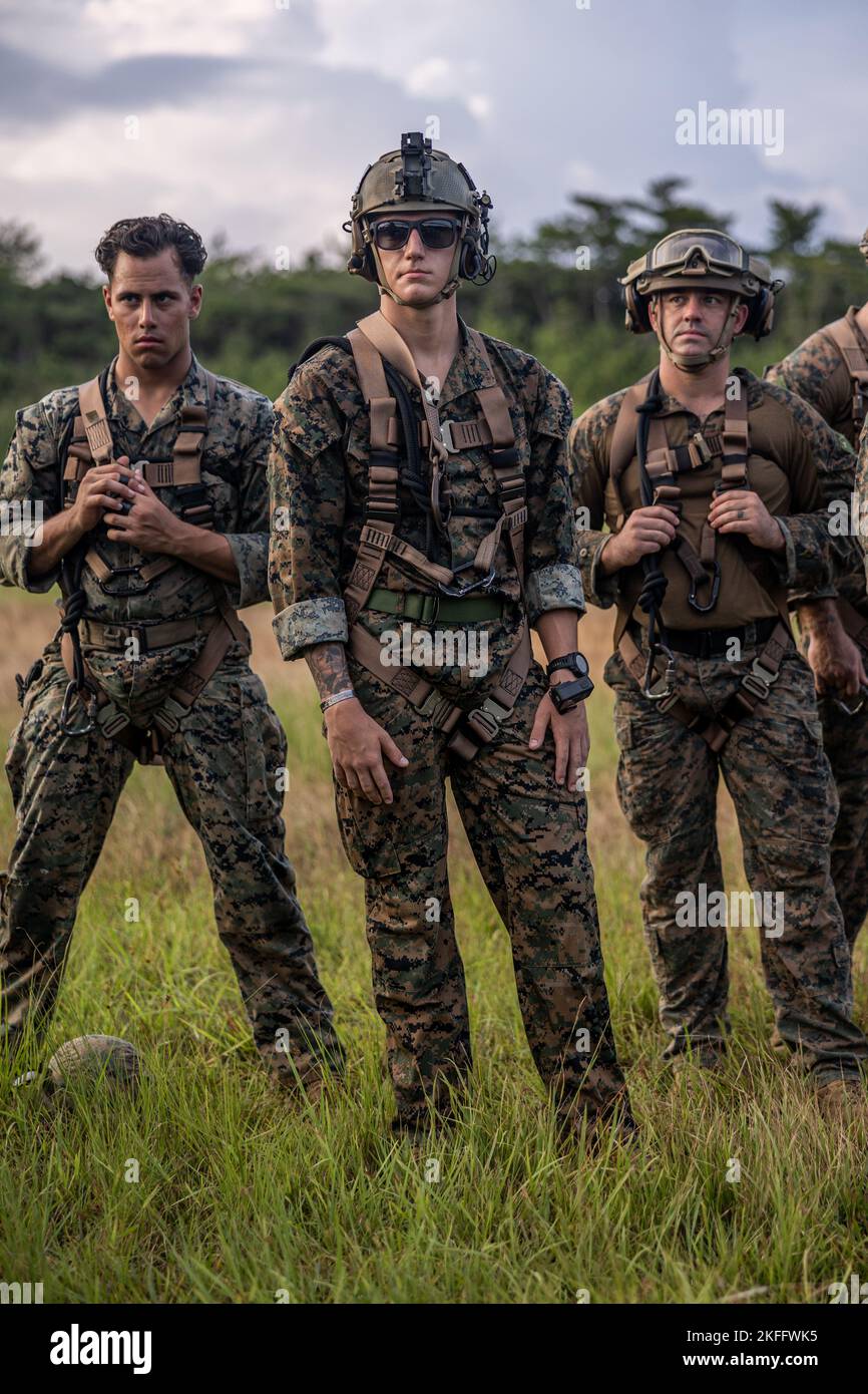 U.S. Marines with III Marine Expeditionary Force (MEF) listen to UH-1Y ...