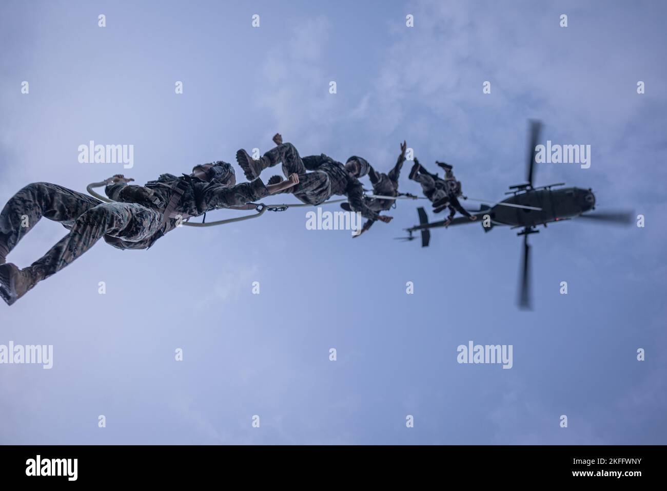 U.S. Marines with III Marine Expeditionary Force (MEF) tack to a UH-1Y ...