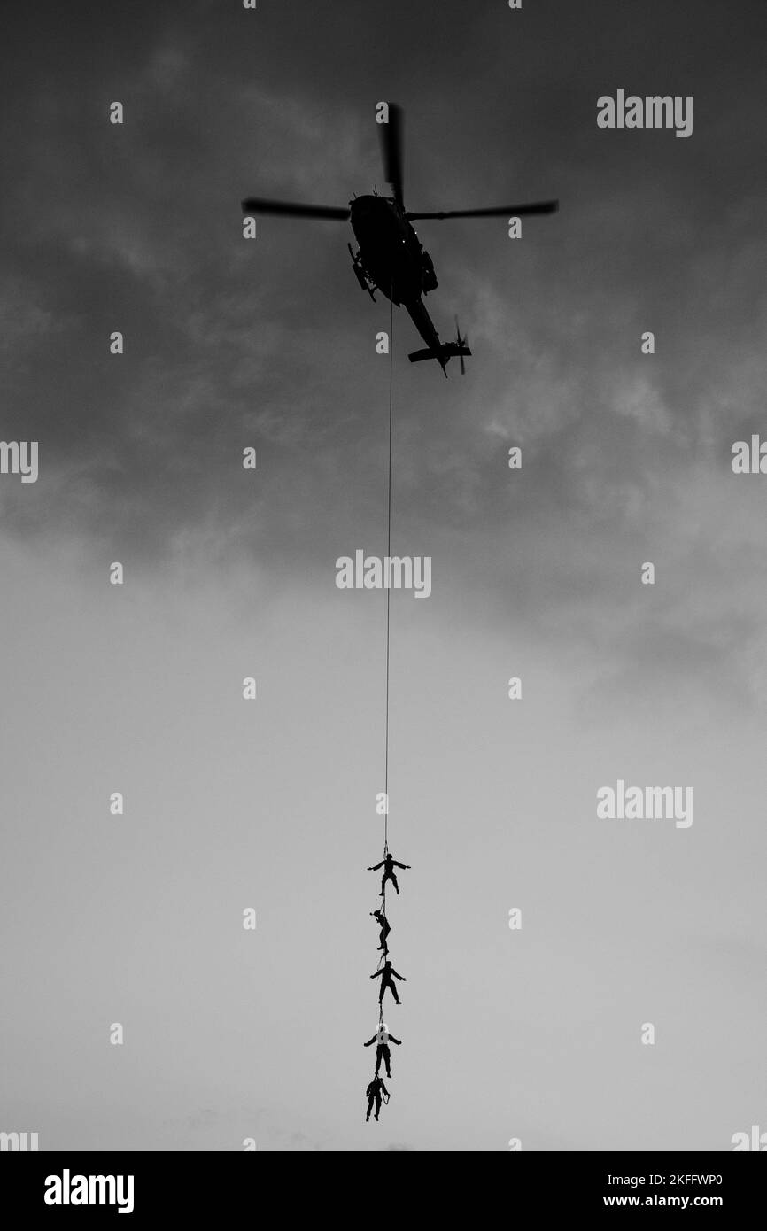 U.S. Marines with III Marine Expeditionary Force (MEF) tack to a UH-1Y ...