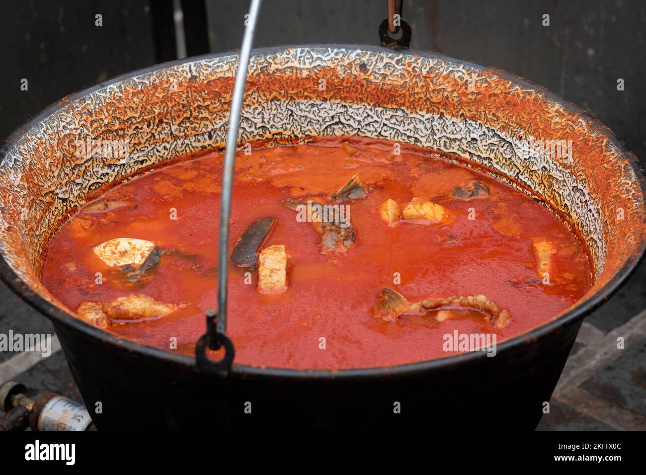 Fisherman's soup in a cauldron, it is a hot, spicy paprika-based fish ...