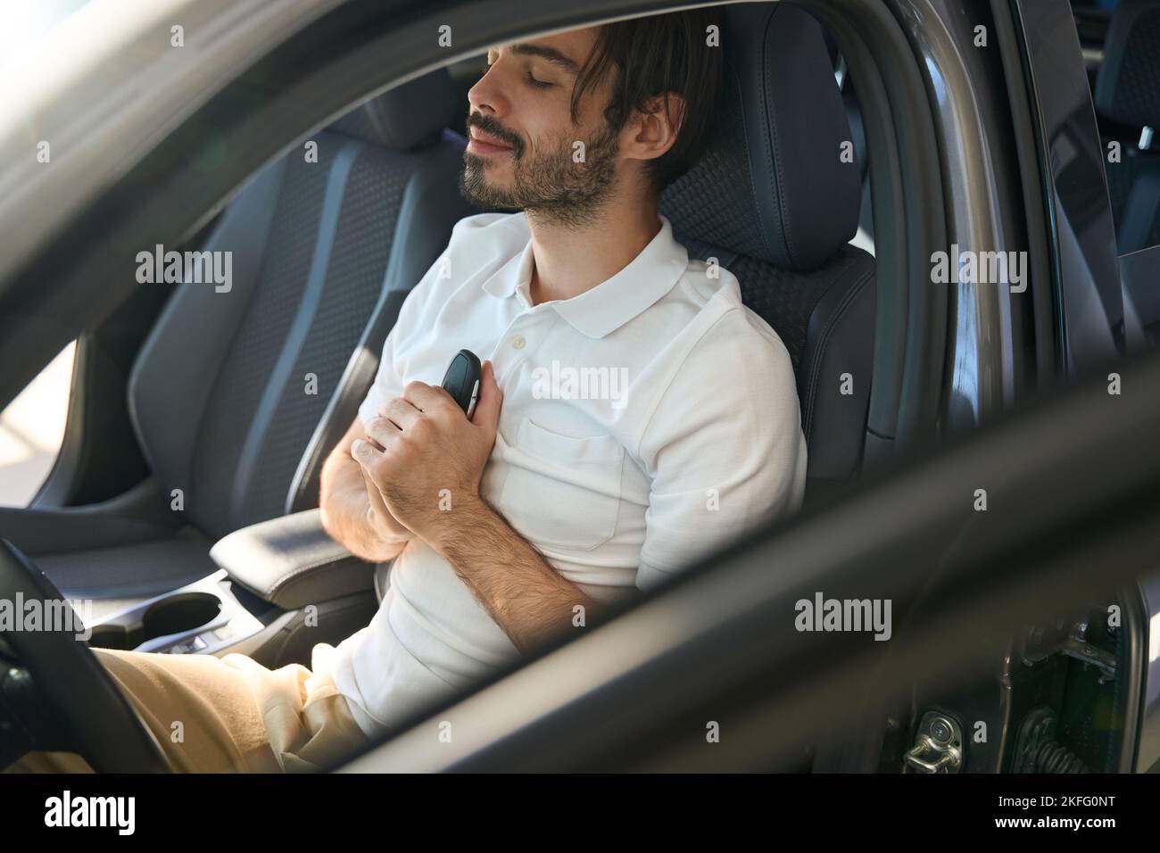 Automotive dealership customer sitting inside new motor vehicle Stock ...