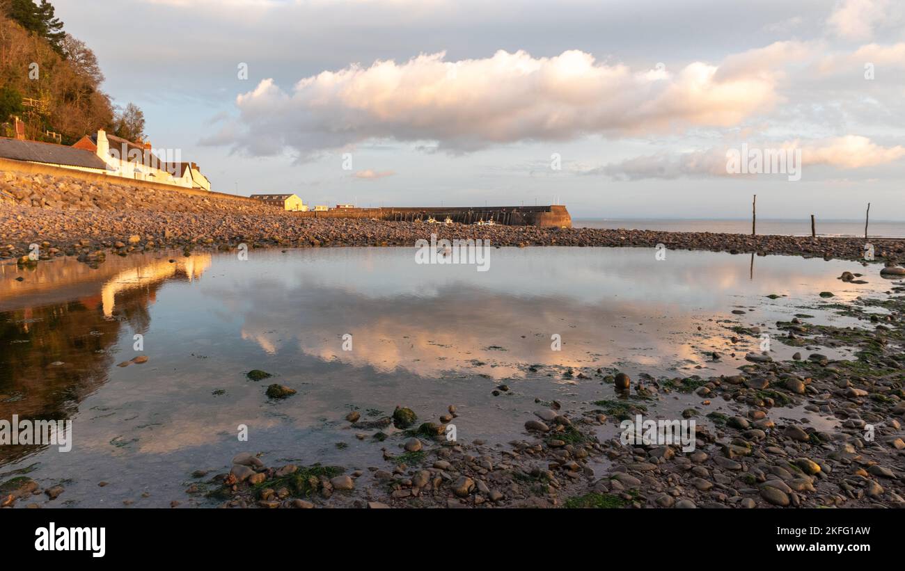 A beautiful landscape of water by the breakwater on the sunrise Stock ...